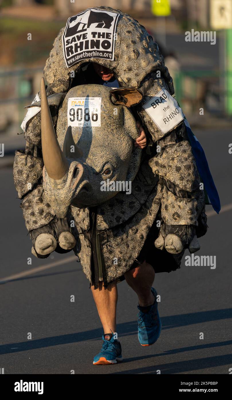 A runner in a rhinoceros costume on Beach Drive in the Royal Victoria ...