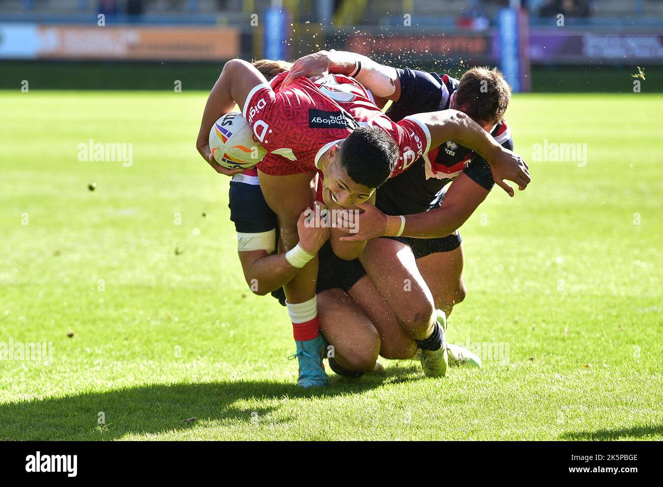 Halifax, England -8th October 2022 - Junior Amone of Tonga attempts to ...