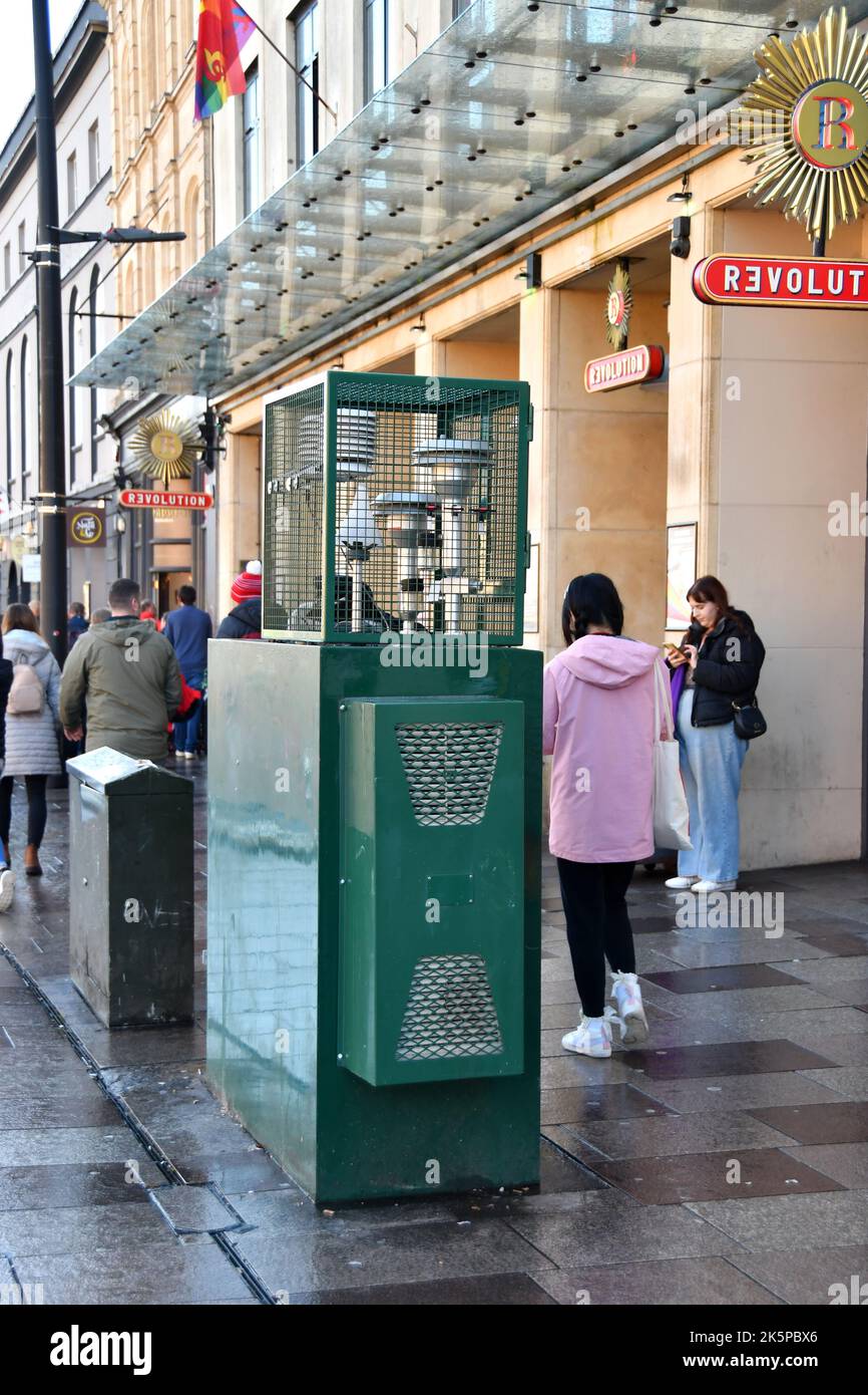 Cardiff, Wales - October 2022: People walking past an air quality ...