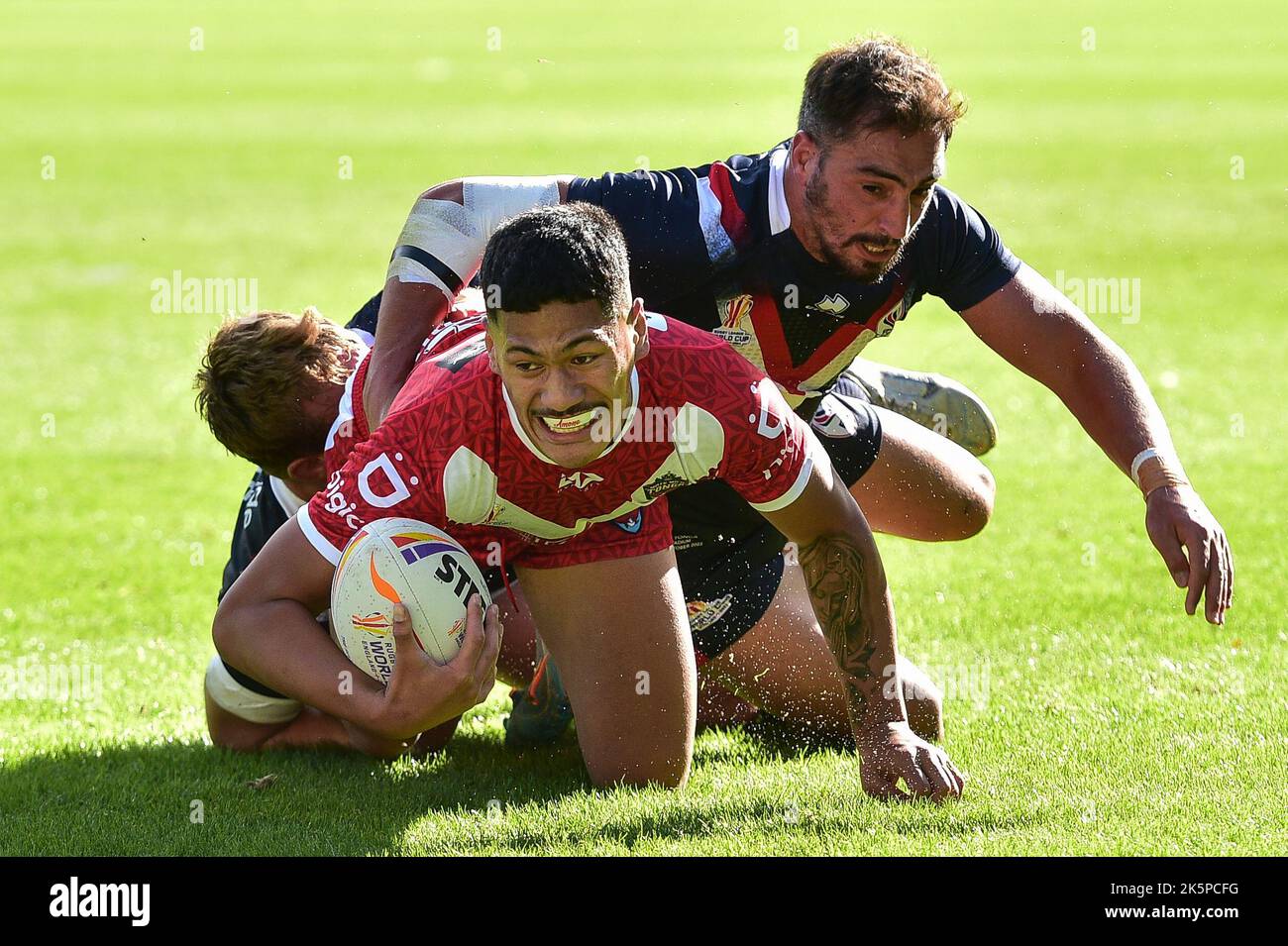 Halifax, England -8th October 2022 - Junior Amone of Tonga attempts to ...