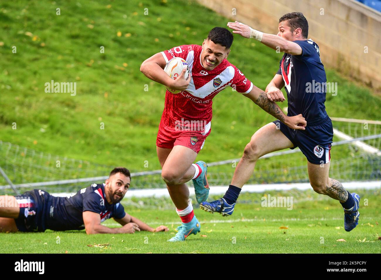 Halifax, England -8th October 2022 - Junior Amone of Tonga evades Eloi ...