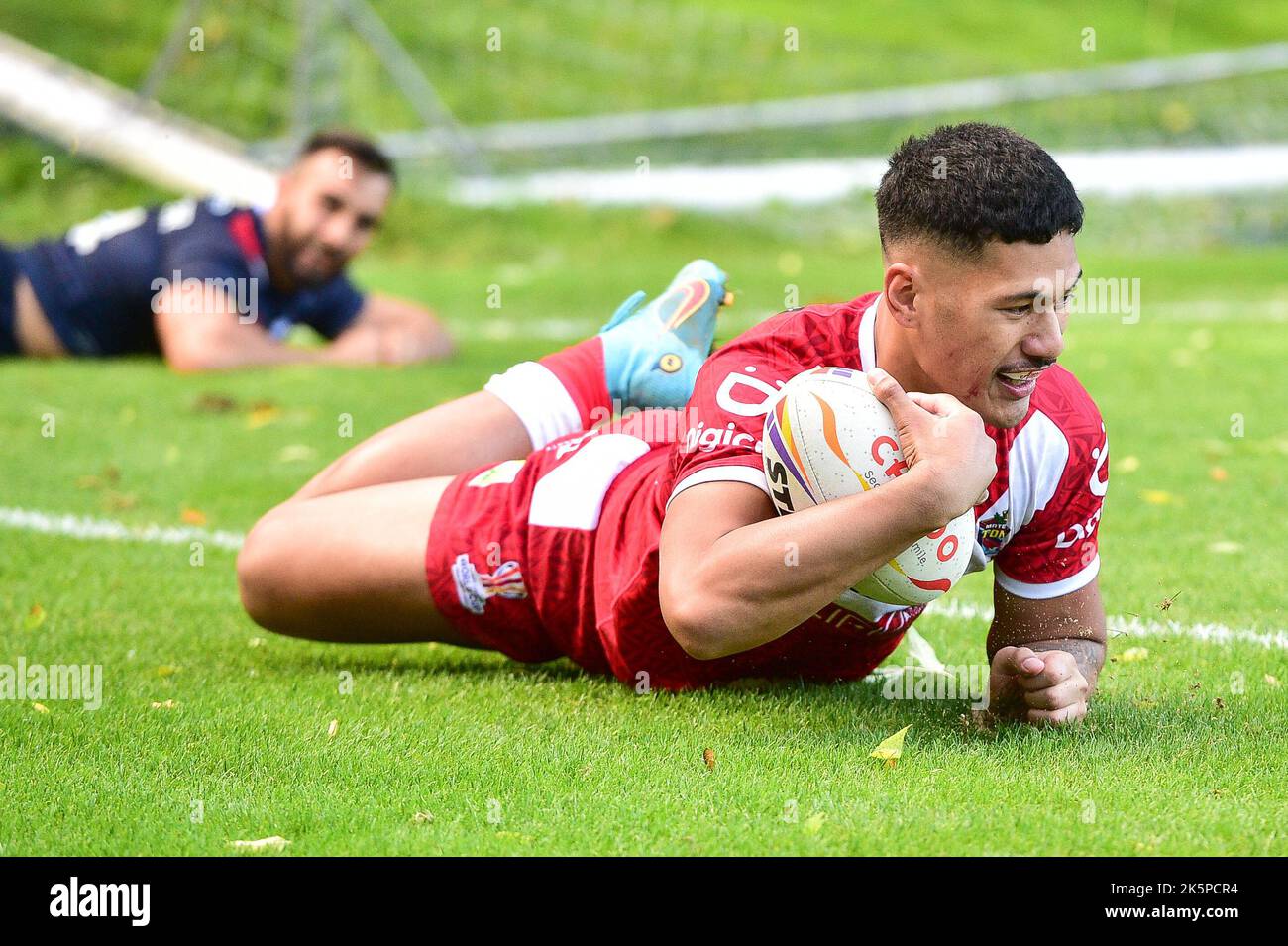 Halifax, England -8th October 2022 - Junior Amone of Tonga evades Eloi ...