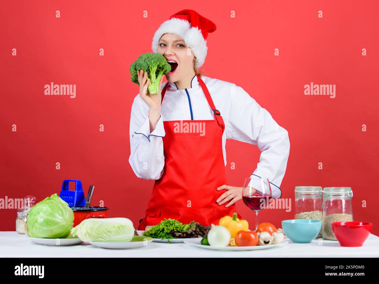 Christmas menu. Woman chef cooking christmas dinner wear santa hat ...