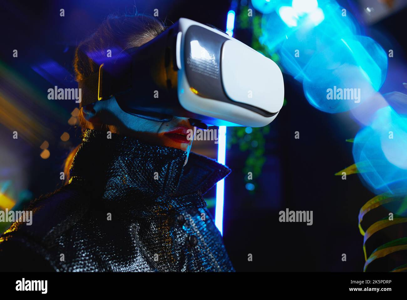 modern middle aged woman in metaverse in vr goggles Stock Photo - Alamy
