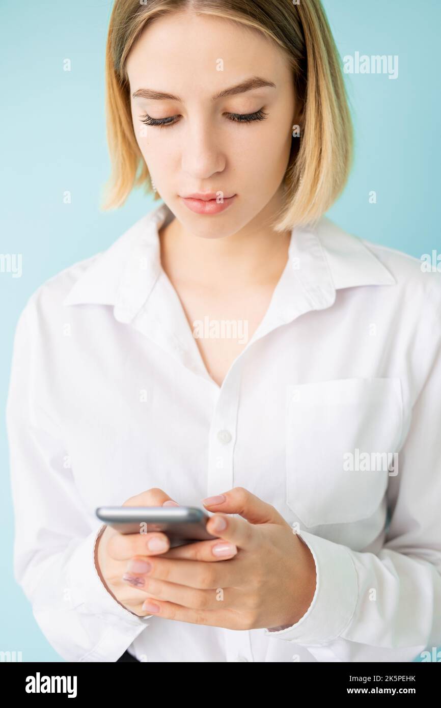 Mobile search. Serious woman. Digital technology. Concentrated lady ...