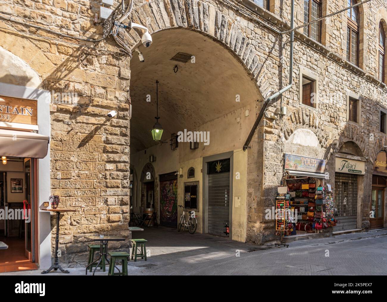 San Pierino's Arch, covered arcade built in the 12th century, with bars ...