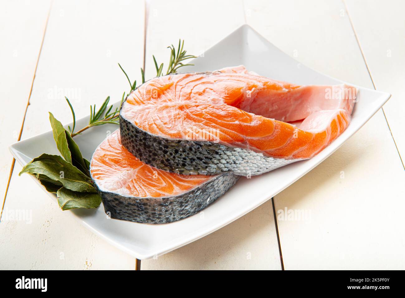 Fresh an raw salmon fillets uncooked on the table of the kitchen ready ...