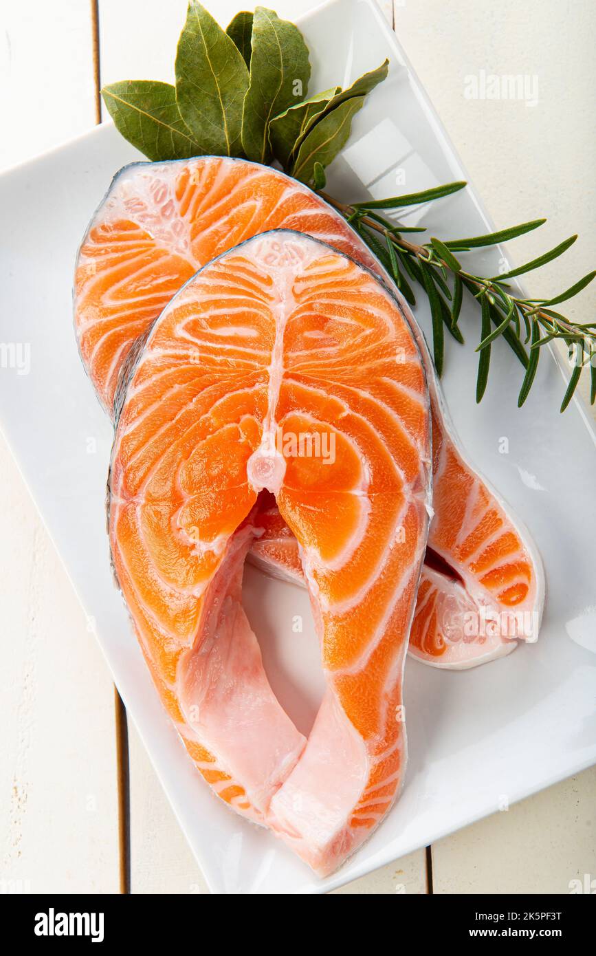 Fresh an raw salmon fillets uncooked on the table of the kitchen ready ...