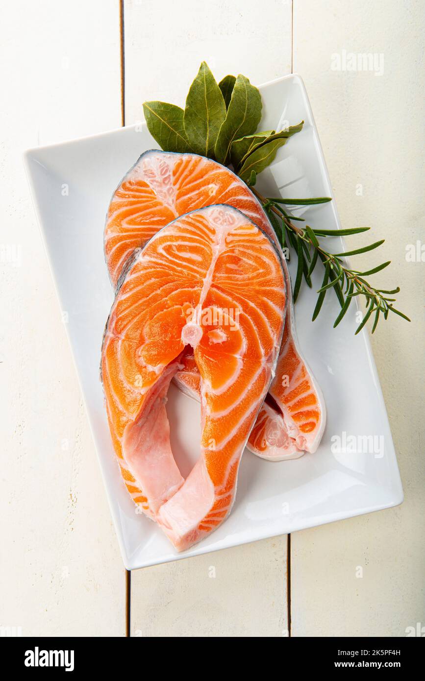 Fresh an raw salmon fillets uncooked on the table of the kitchen ready ...