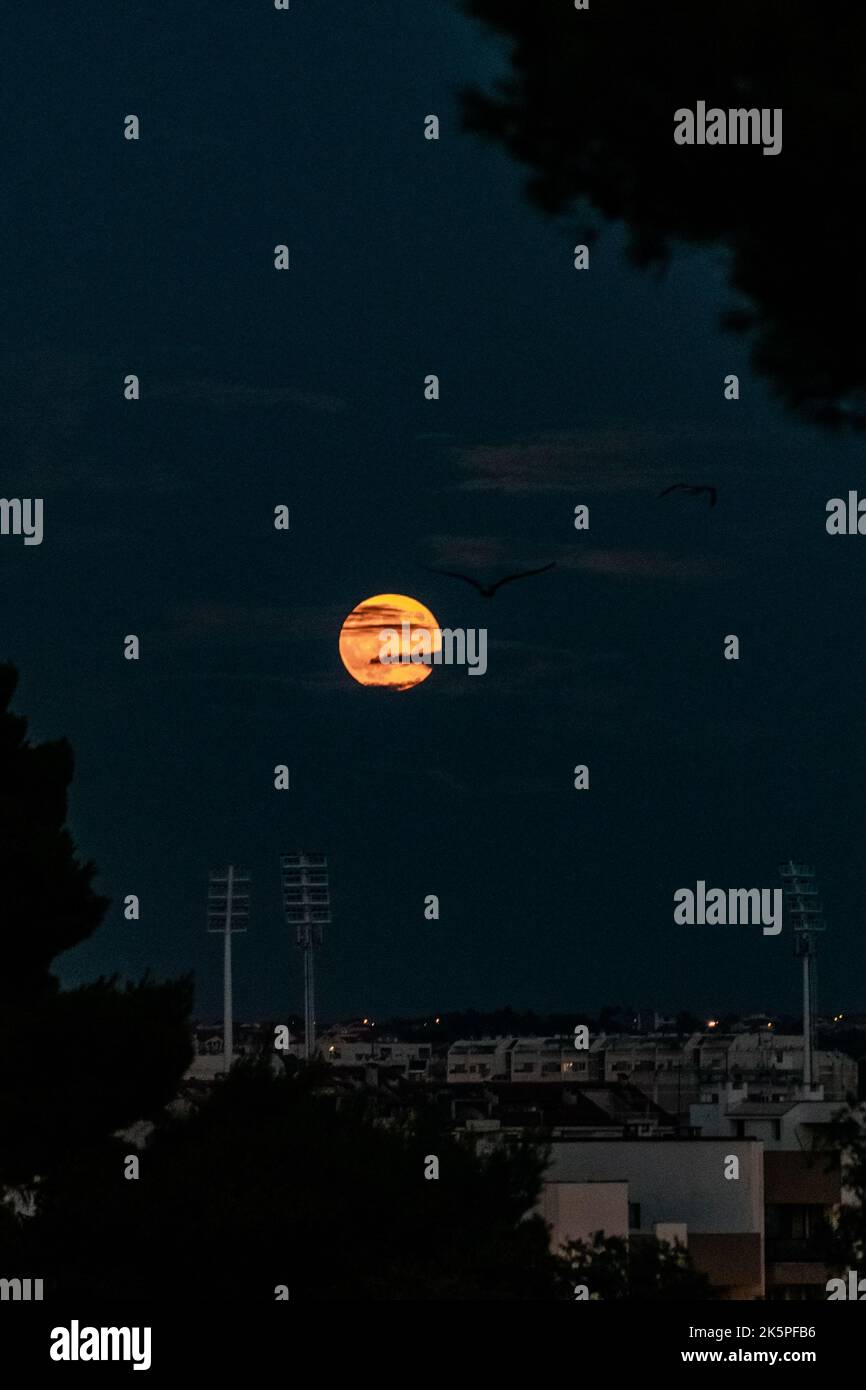 A full moon is seen in the sky in Zadar, Croatia on October 10, 2022 ...
