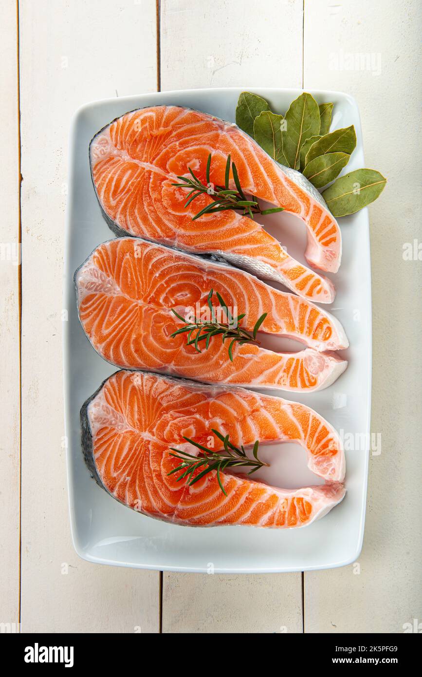 Fresh an raw salmon fillets uncooked on the table of the kitchen ready ...