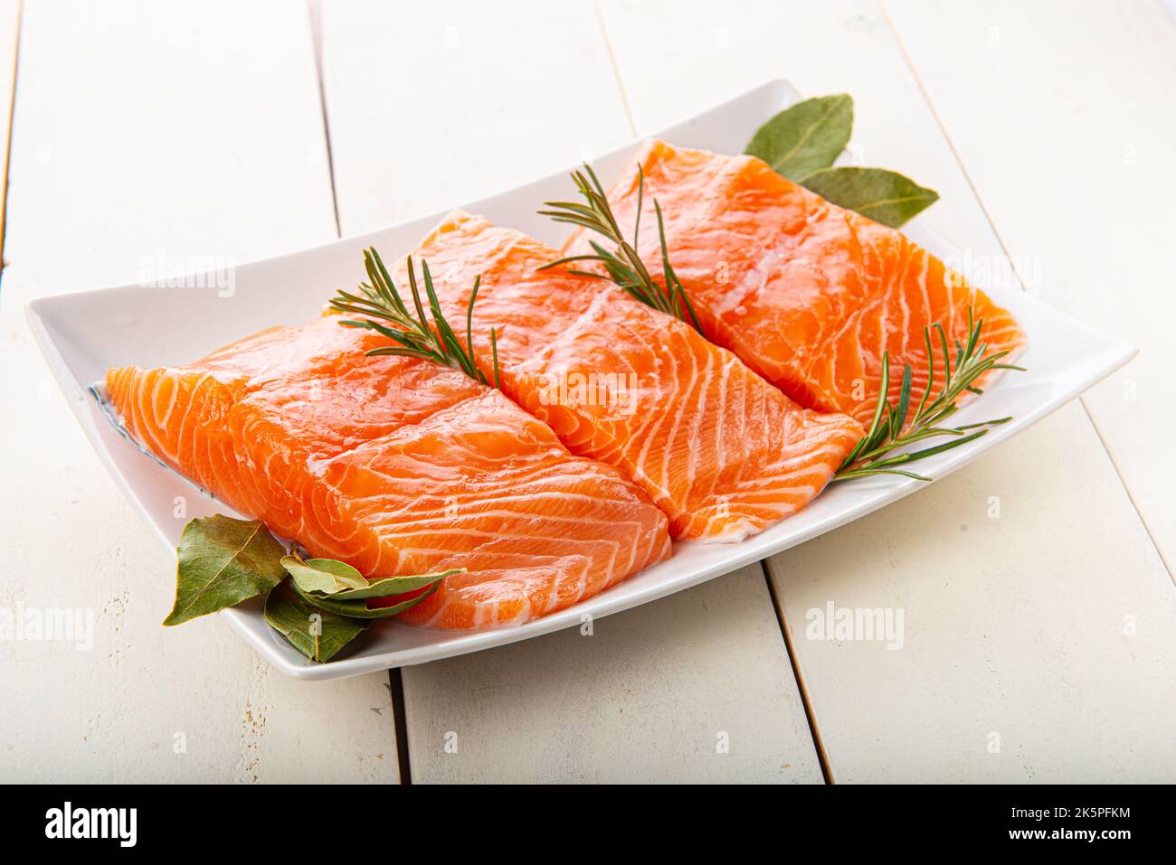 Fresh an raw salmon fillets uncooked on the table of the kitchen ready ...