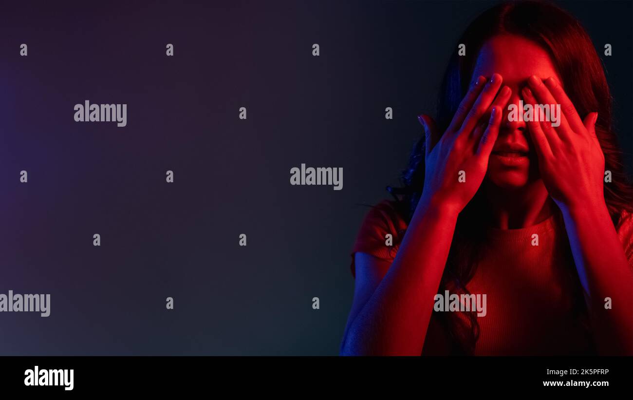 scared woman anxiety problem banner woman neon Stock Photo - Alamy