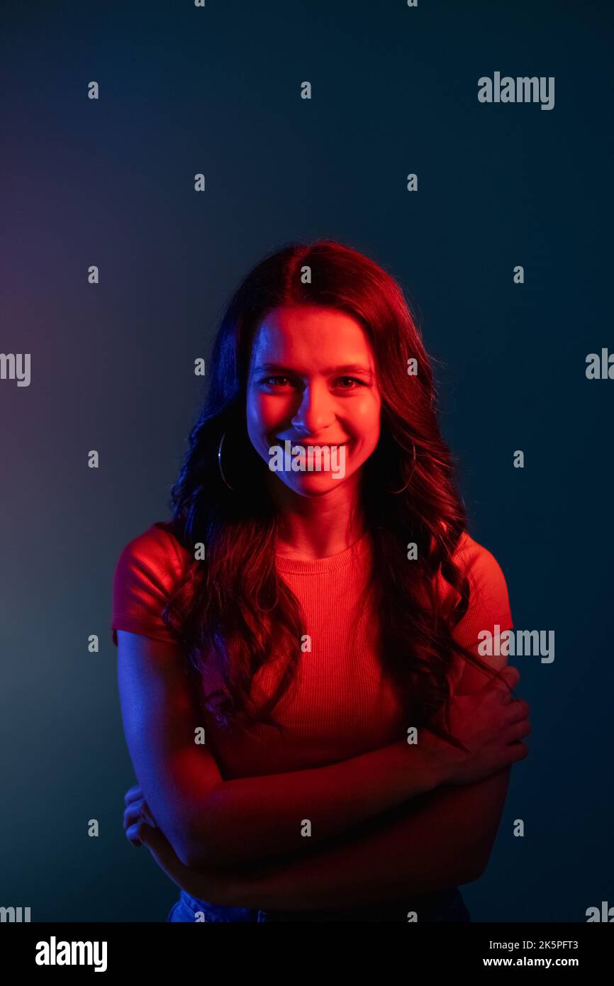 neon light woman happy smile positive girl red Stock Photo - Alamy