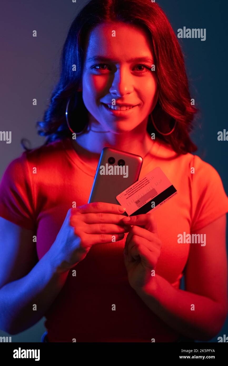 secure payment cyber banking woman neon phone card Stock Photo - Alamy