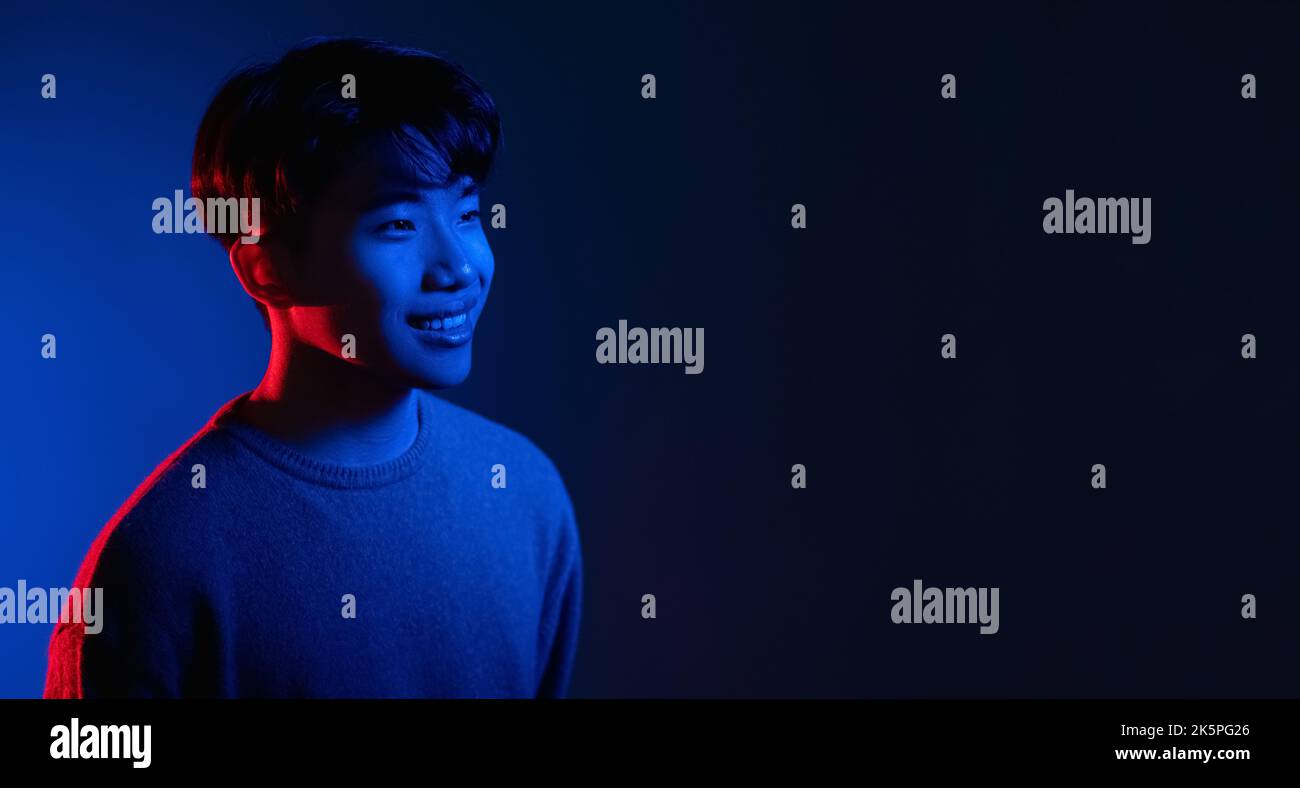 neon light man cyberpunk banner asian guy blue Stock Photo - Alamy