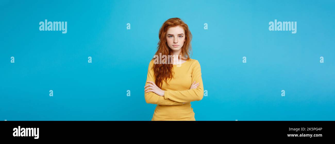 Portrait of young beautiful ginger woman with tender serious face ...