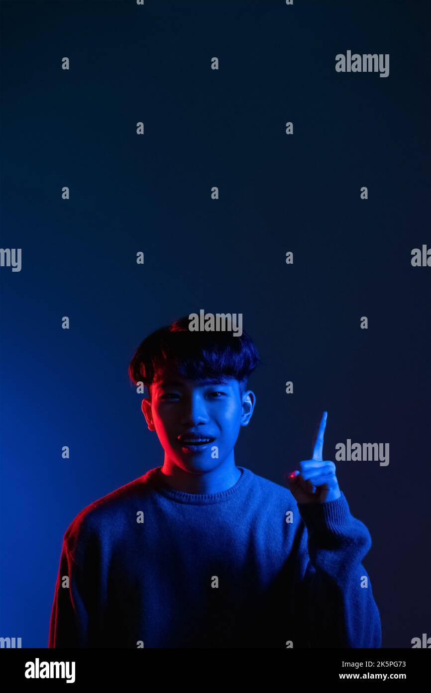 pointing man attention gesture finger neon light Stock Photo - Alamy