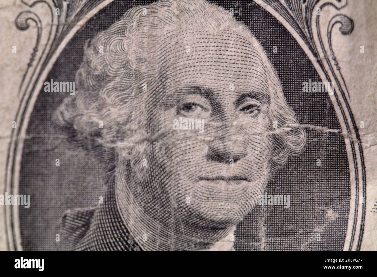 Macro view of George Washington on worn out dirty US one dollar bill ...