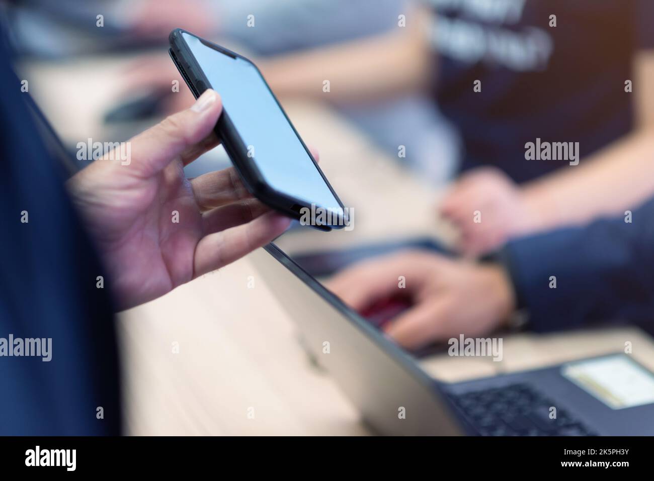 Conference Staff Member scan a QR code from attendee upon arrival to ...