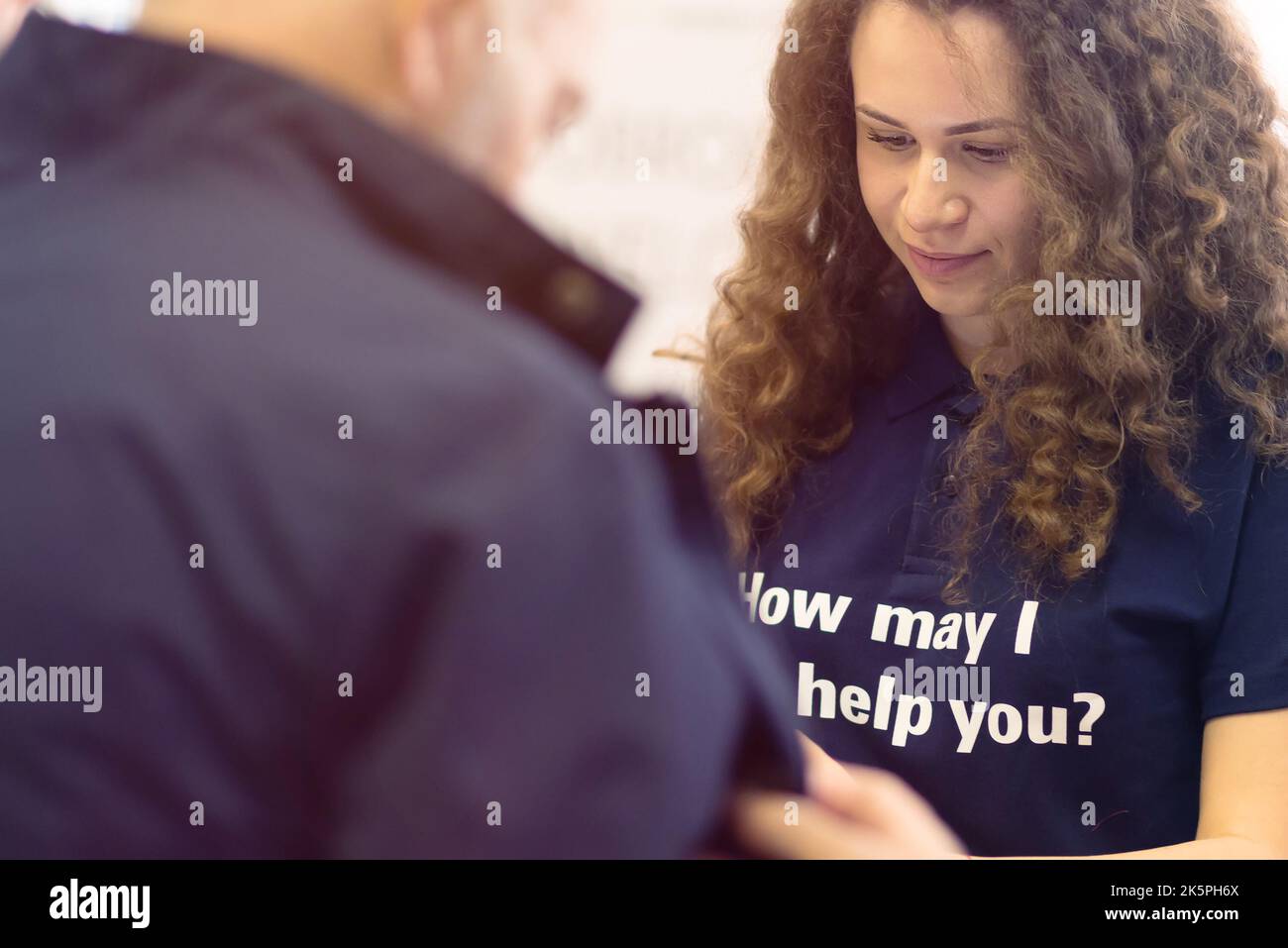 Conference Staff Member scan a QR code from attendee upon arrival to ...