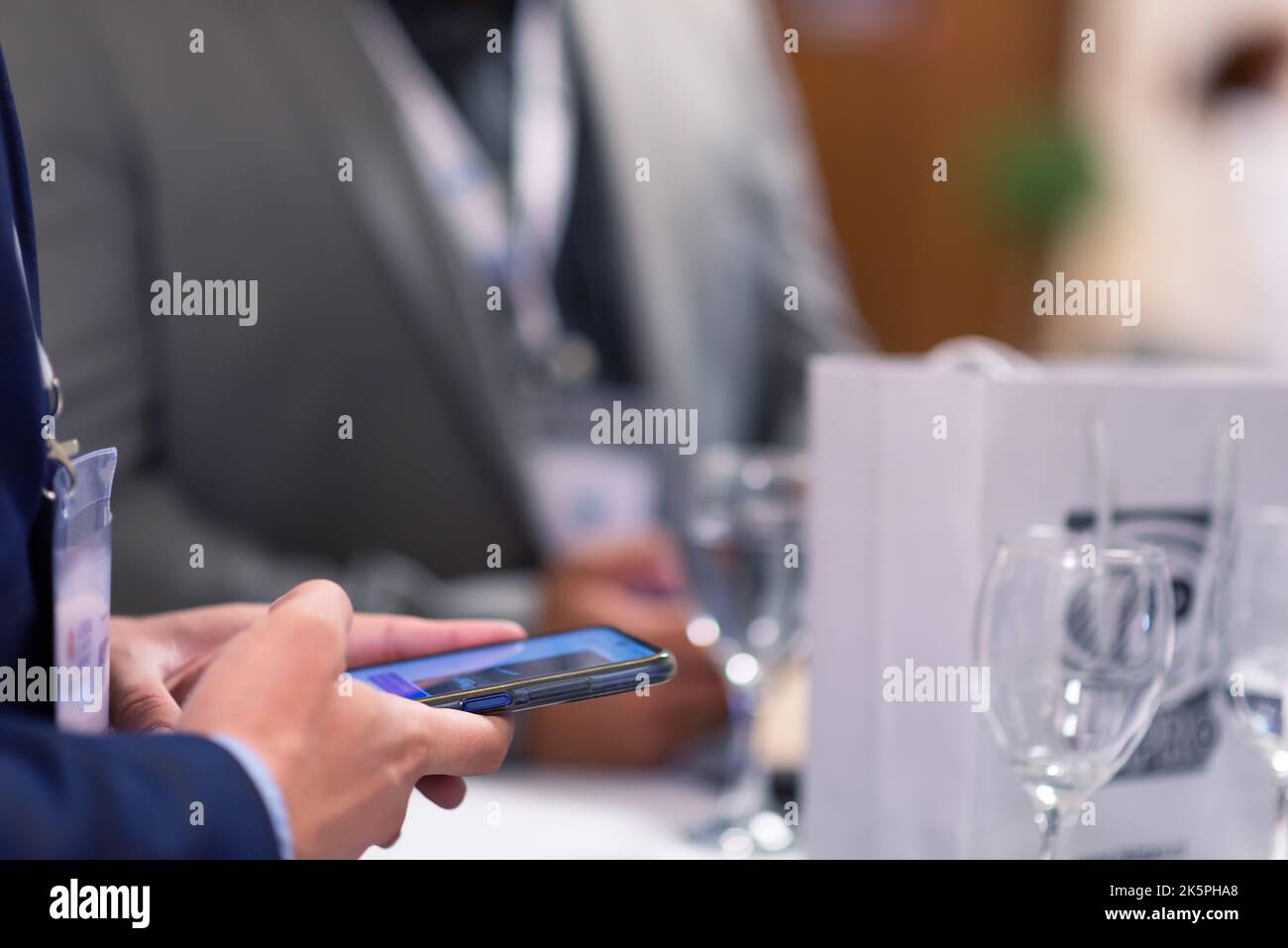 Conference Staff Member scan a QR code from attendee upon arrival to ...