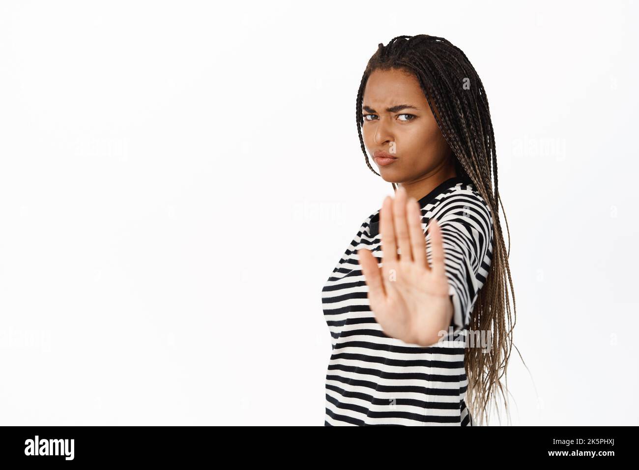 Stop this. Serious african woman extending hand at camera, showing palm ...