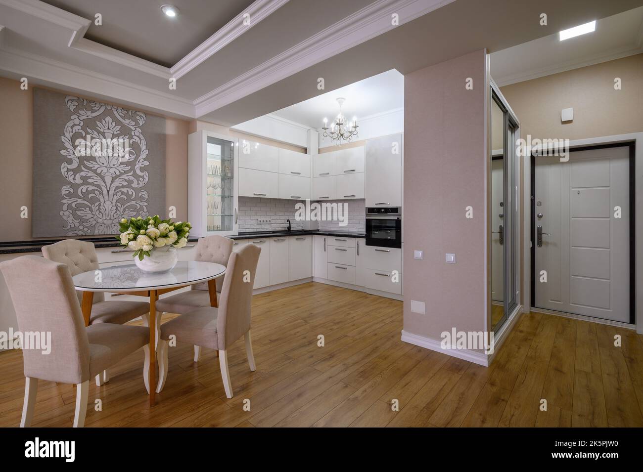 Luxury white modern kitchen with rose walls in studio apartment Stock ...
