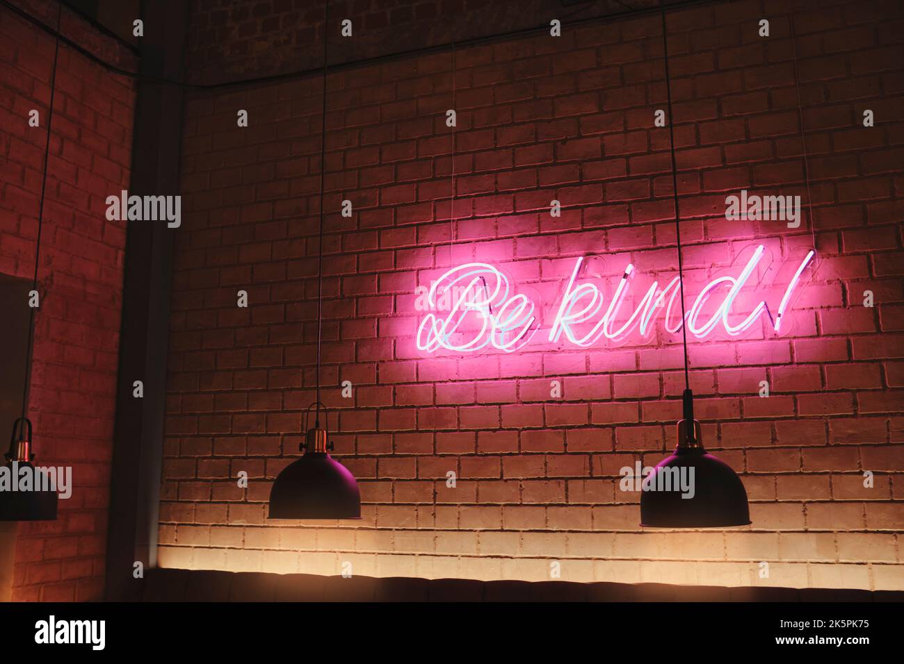 Neon sign of word BE KIND in the interior bar, Concept of relaxing ...