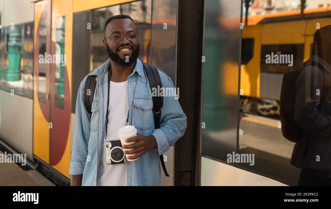 Man standing train station hi-res stock photography and images - Alamy