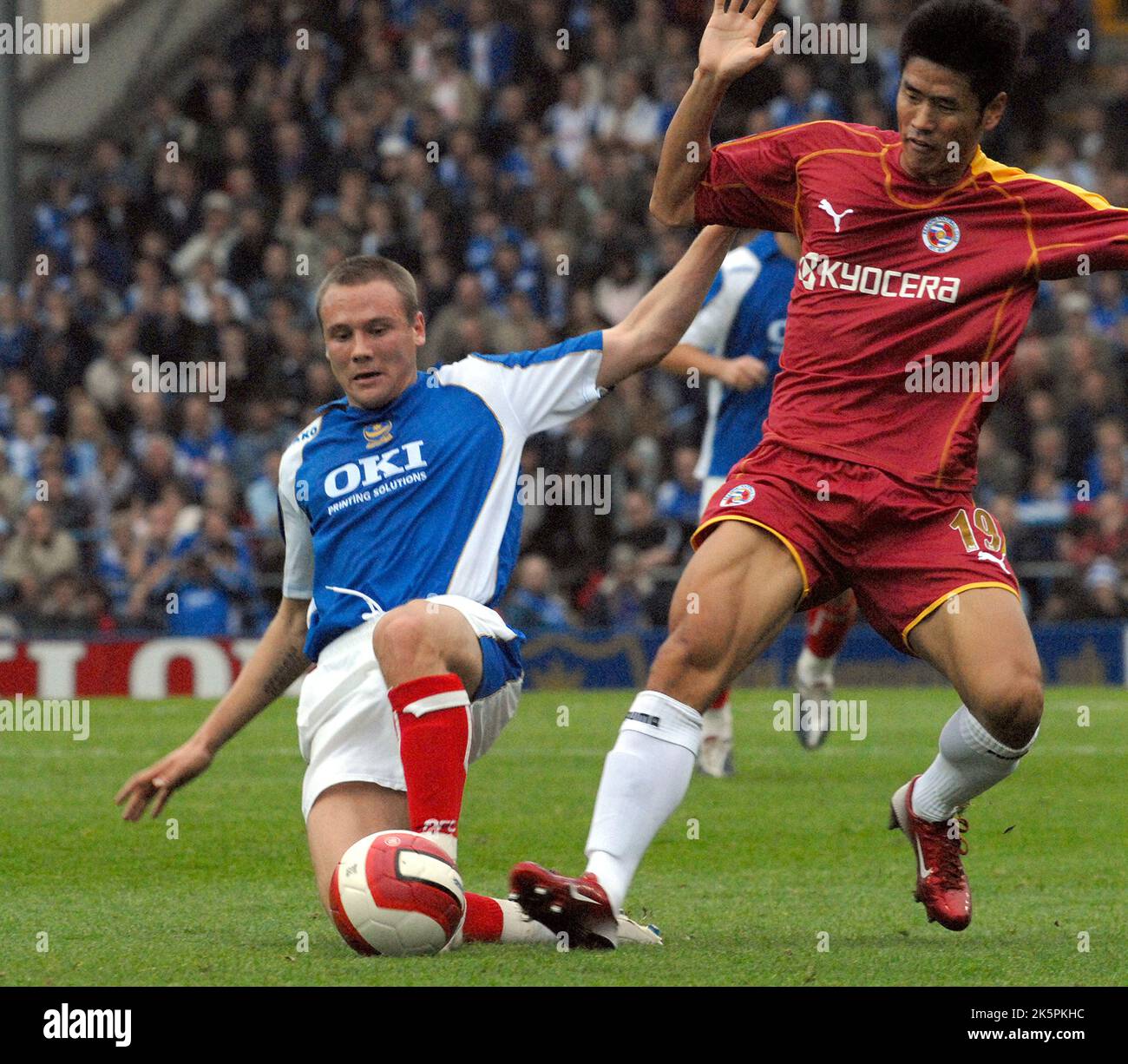 PORTSMOUTH V READING MATTHEW TAYLOR SLIDES THE BALL AWAY FROM SEOL KI ...