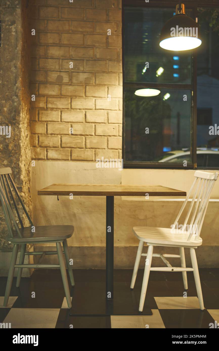 Cozy restaurant to meet with friends, Empty wooden table for present ...