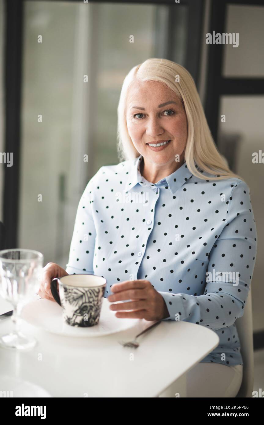 Joyous attractive lady during the coffee break Stock Photo - Alamy