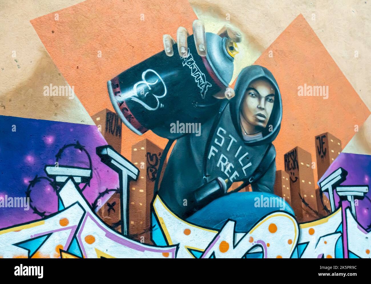 Mural depicting hooded artist with spray. Streets of Fener, Balat ...