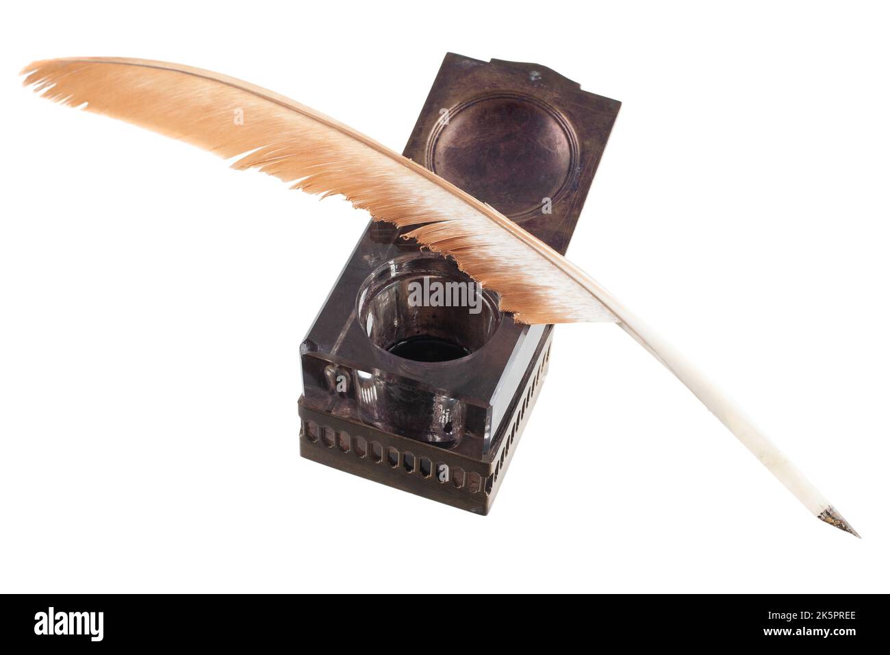 Old vintage feather quill with glass inkwell isolated on white ...