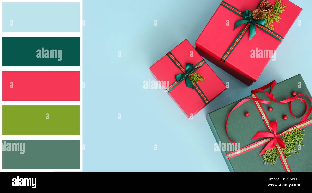 Beautiful Christmas gift boxes on light blue background. Different ...