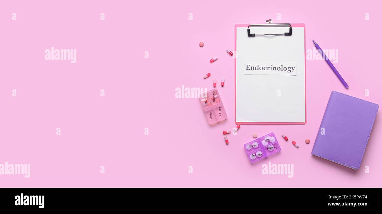 Clipboard with word ENDOCRINOLOGY and pills on pink background with ...