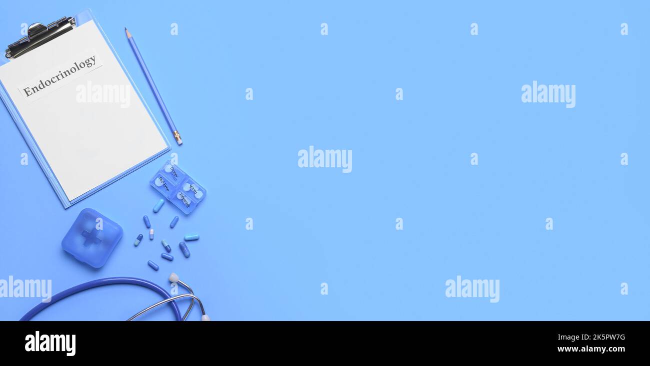 Clipboard with word ENDOCRINOLOGY, stethoscope and pills on blue ...
