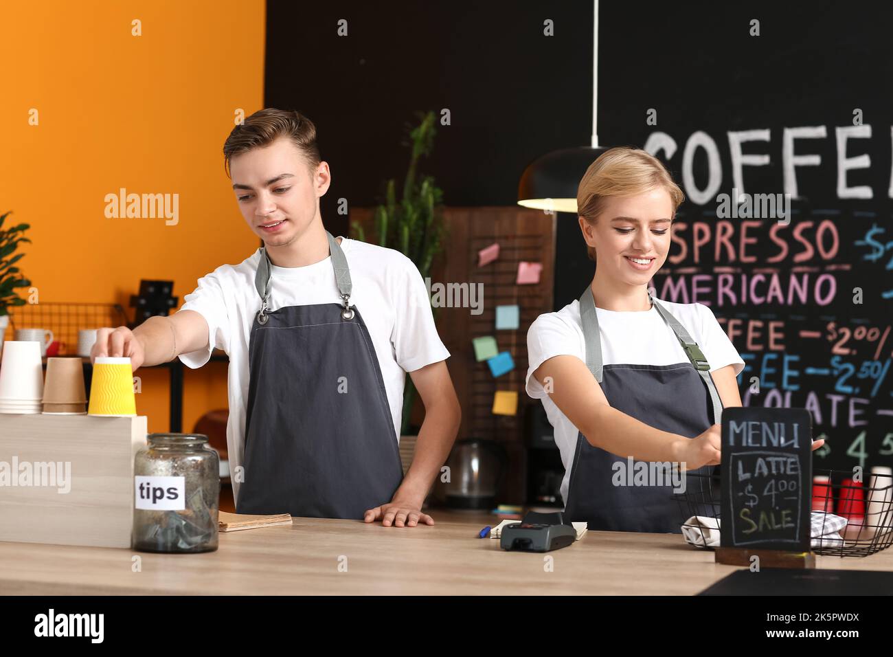 Young baristas working in cafe Stock Photo - Alamy