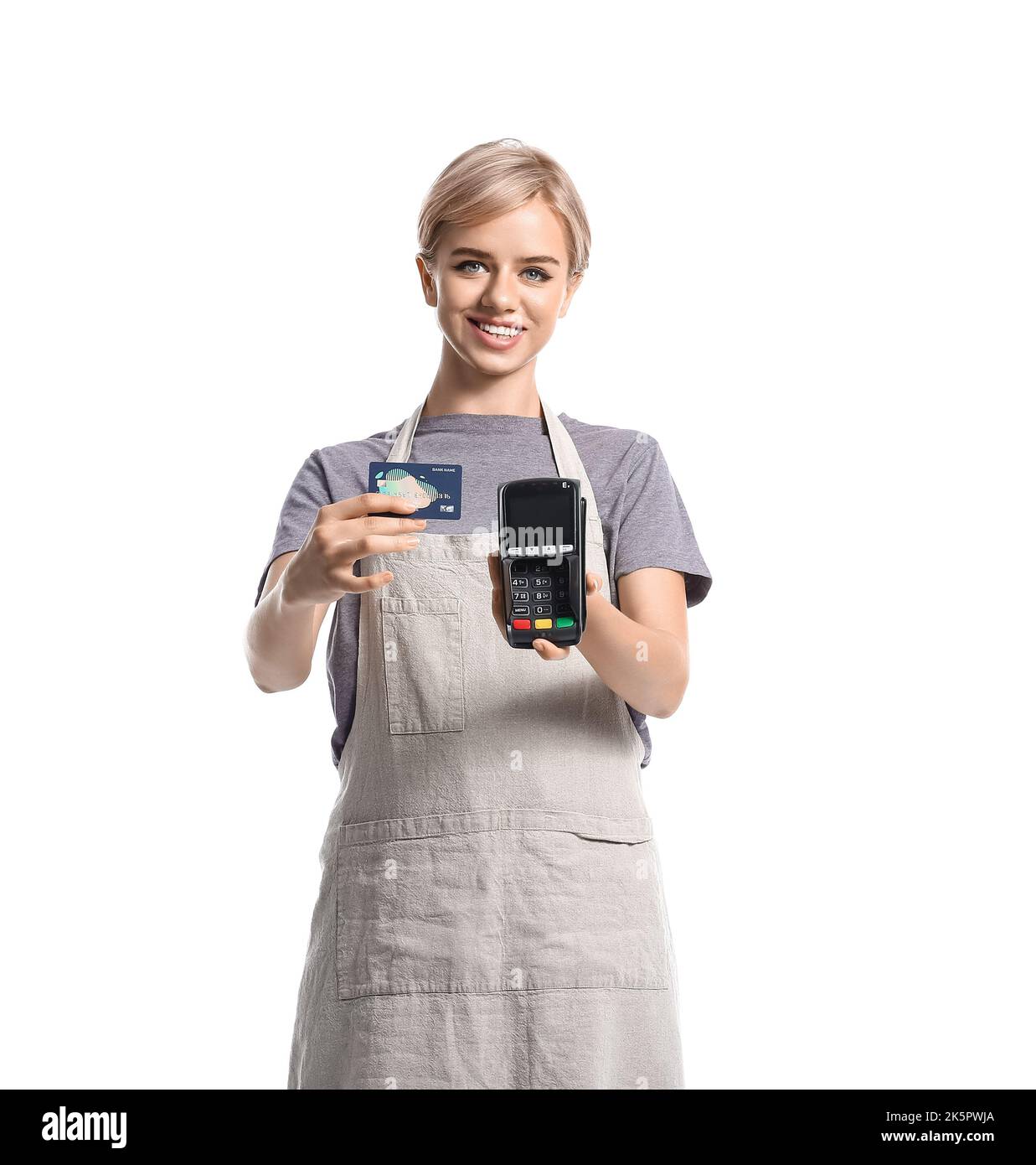 Female barista with payment terminal and credit card on white ...