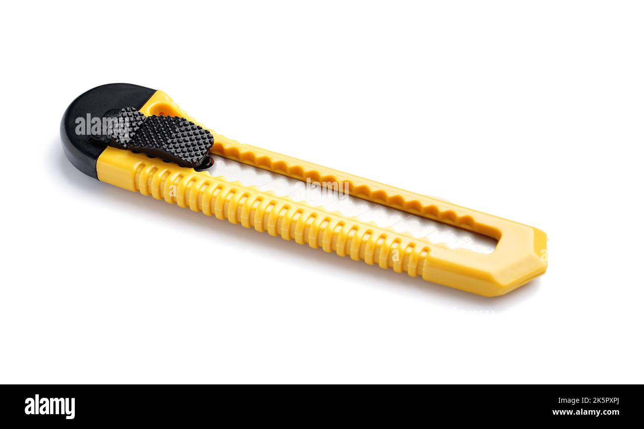 Yellow utility knife on white background Stock Photo - Alamy