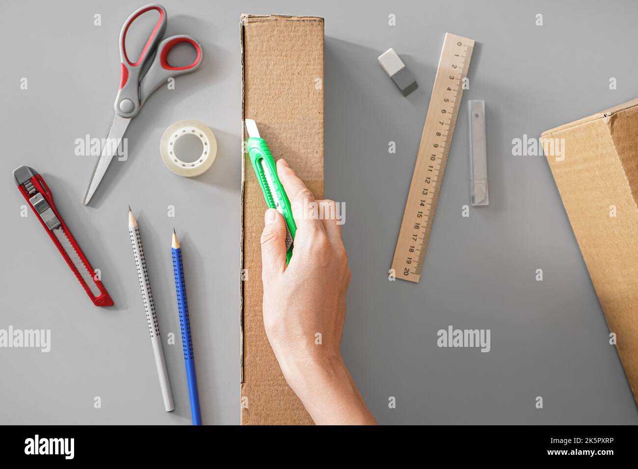 Opening box boxcutter hi-res stock photography and images - Alamy