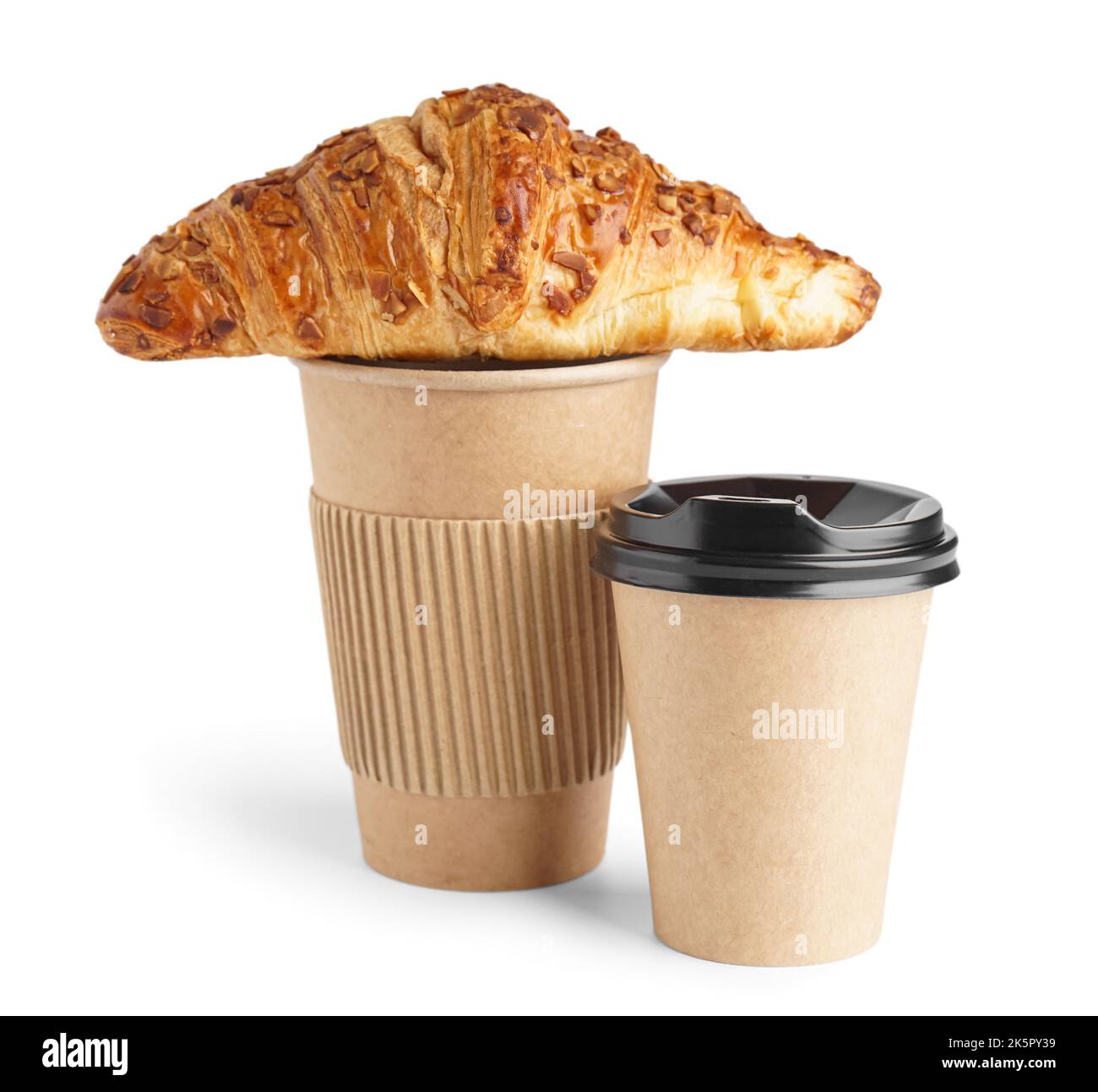 Paper cups and delicious croissant on white background Stock Photo - Alamy