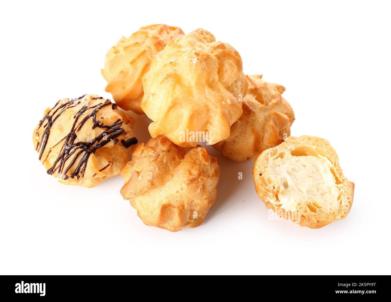 Tasty round eclairs with cream on white background Stock Photo - Alamy