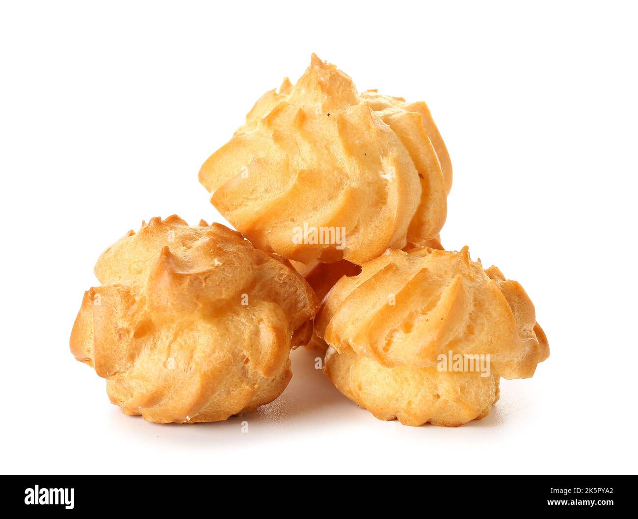 Tasty round eclairs on white background Stock Photo - Alamy