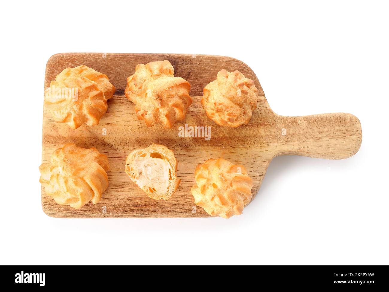 Board with tasty round eclairs on white background Stock Photo - Alamy