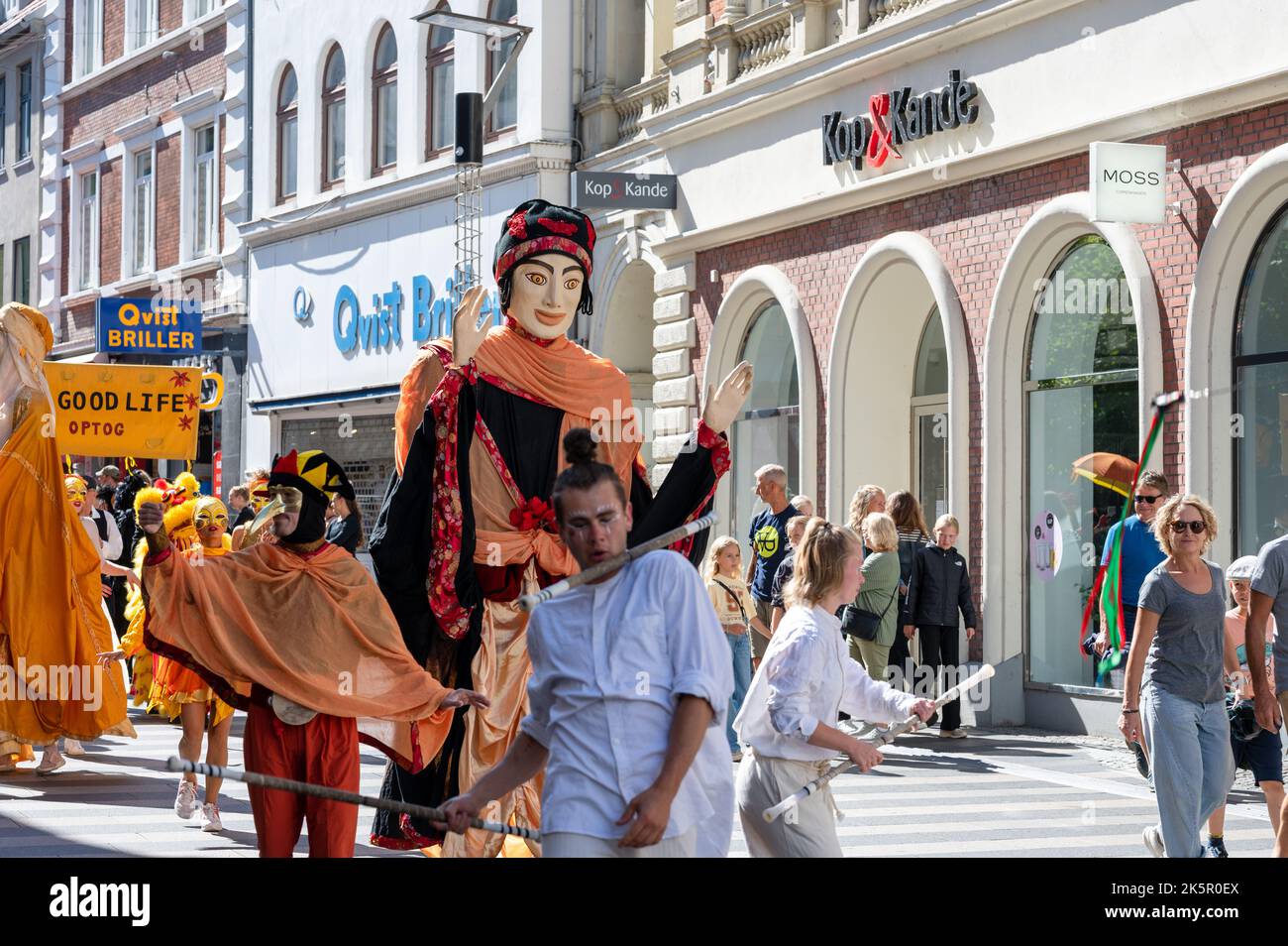 Kosmos Good Life Parade - Showing a massive doll in a crowd in Aarhus ...