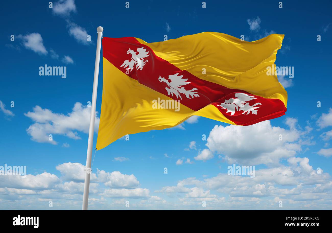 flag of Lorraine, Europe at cloudy sky background, panoramic view. flag ...