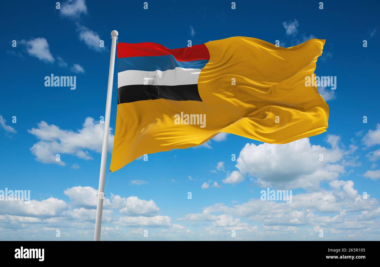 flag of Manchukuo, asia at cloudy sky background, panoramic view. flag ...