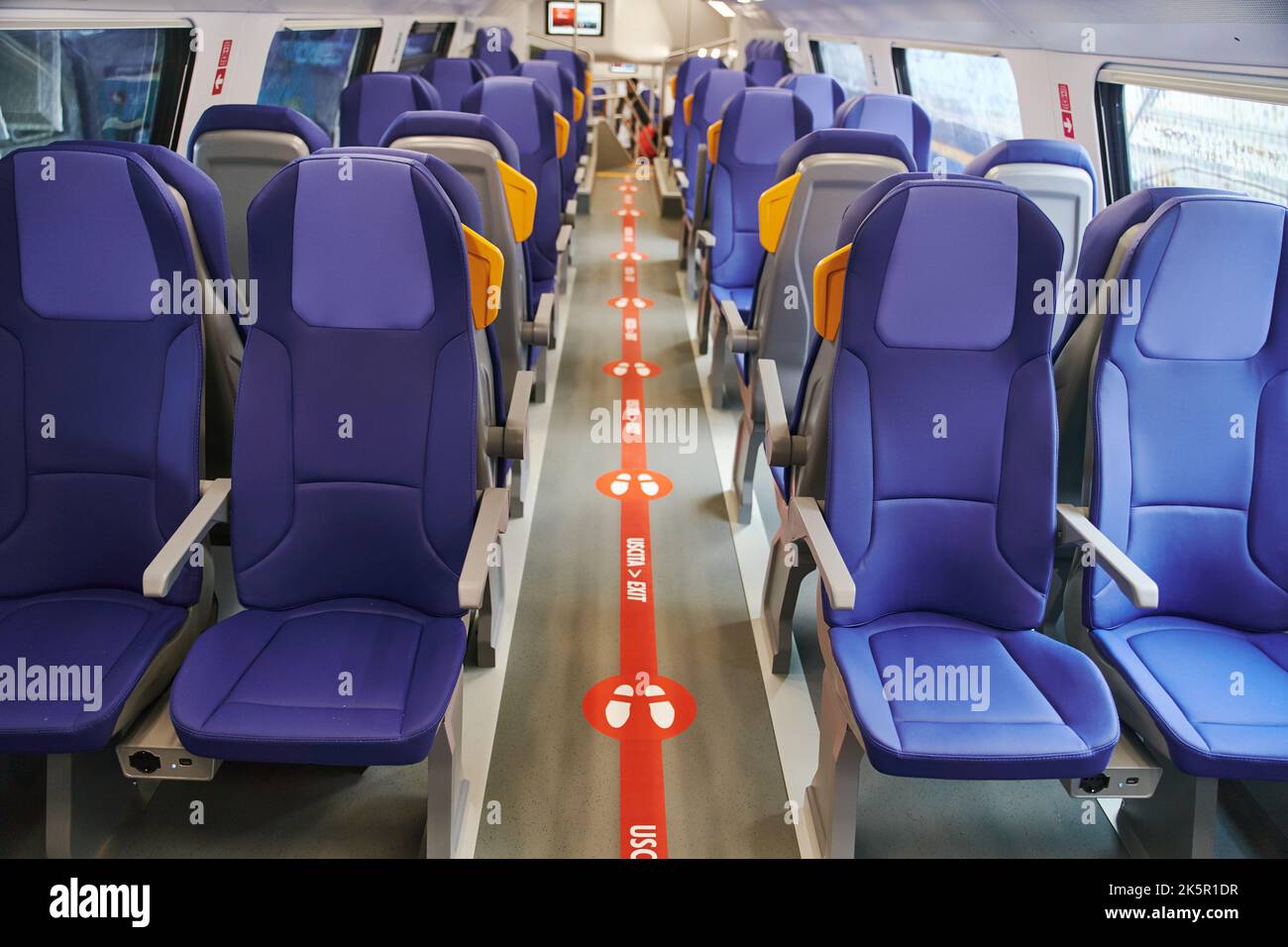 Modern high speed train interior with empty blue seats Stock Photo - Alamy
